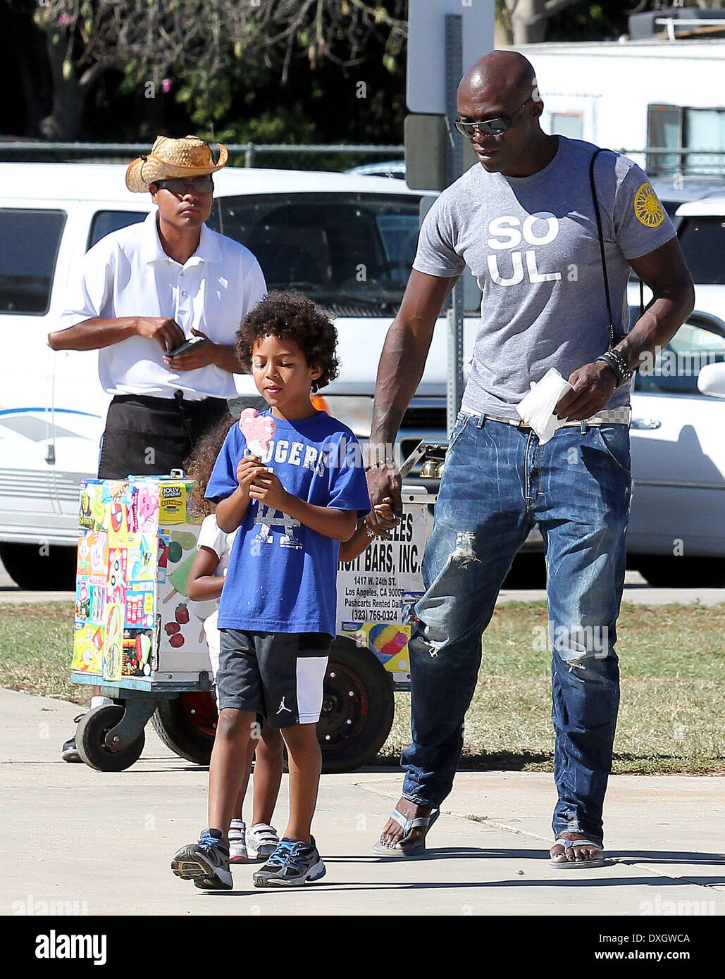 Johan Samuel and Seal Seal buys his children ice cream at a park in ...