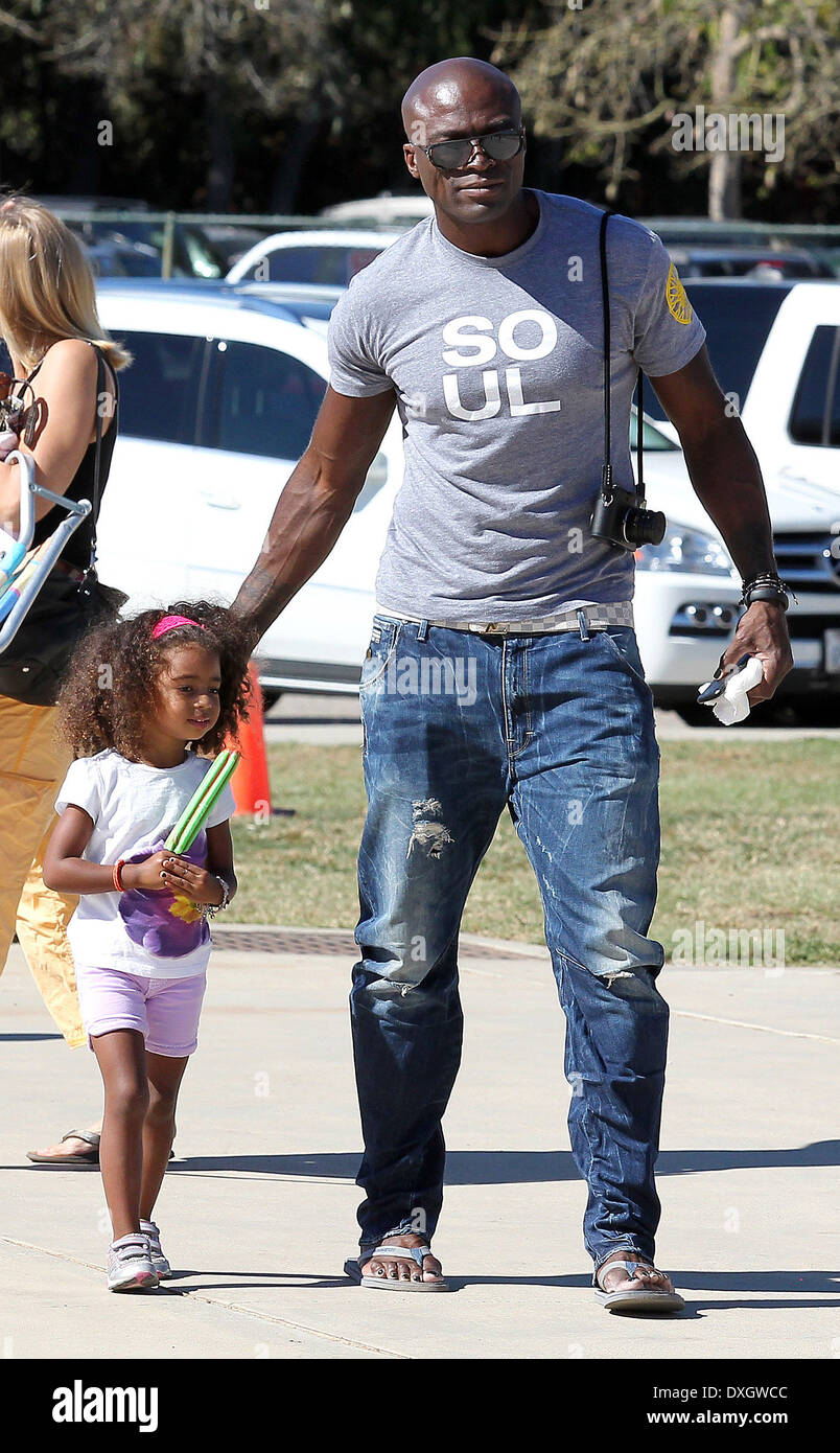 Lou Samuel and Seal Seal buys his children ice cream at a park in ...