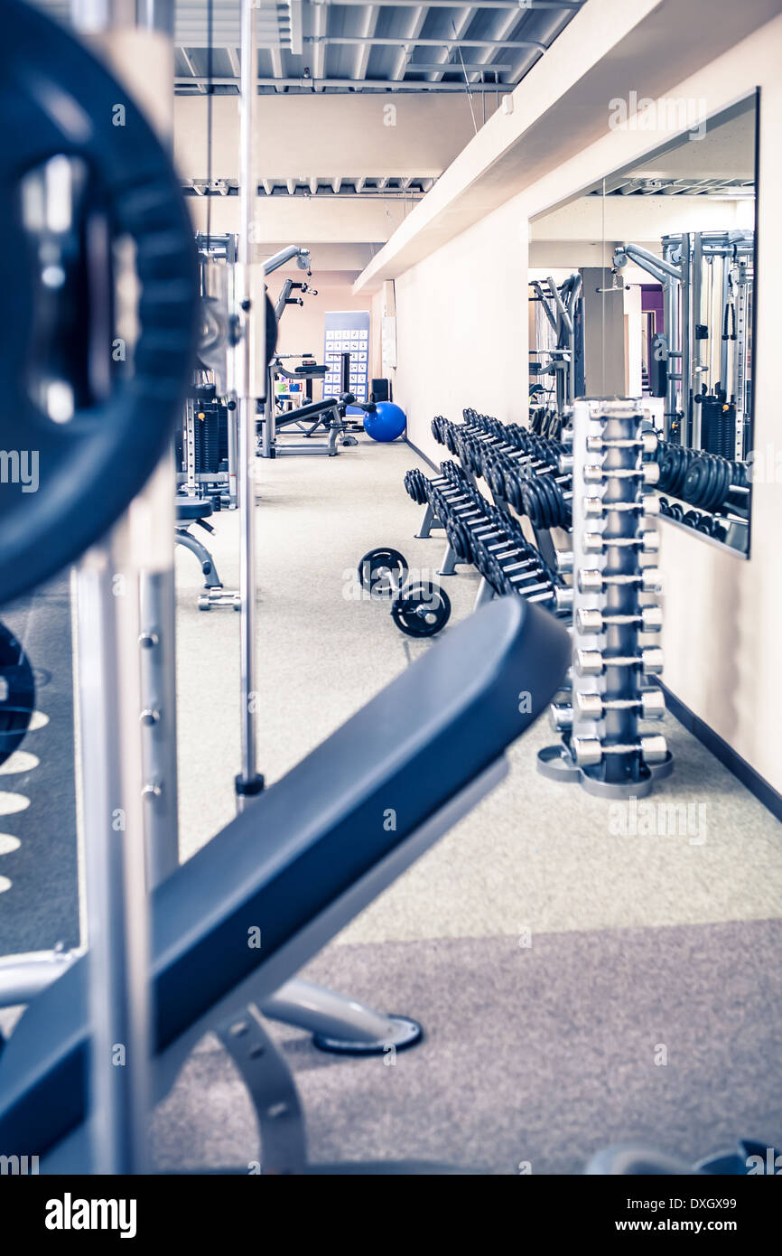 diverse equipment and machines at the gym room Stock Photo - Alamy