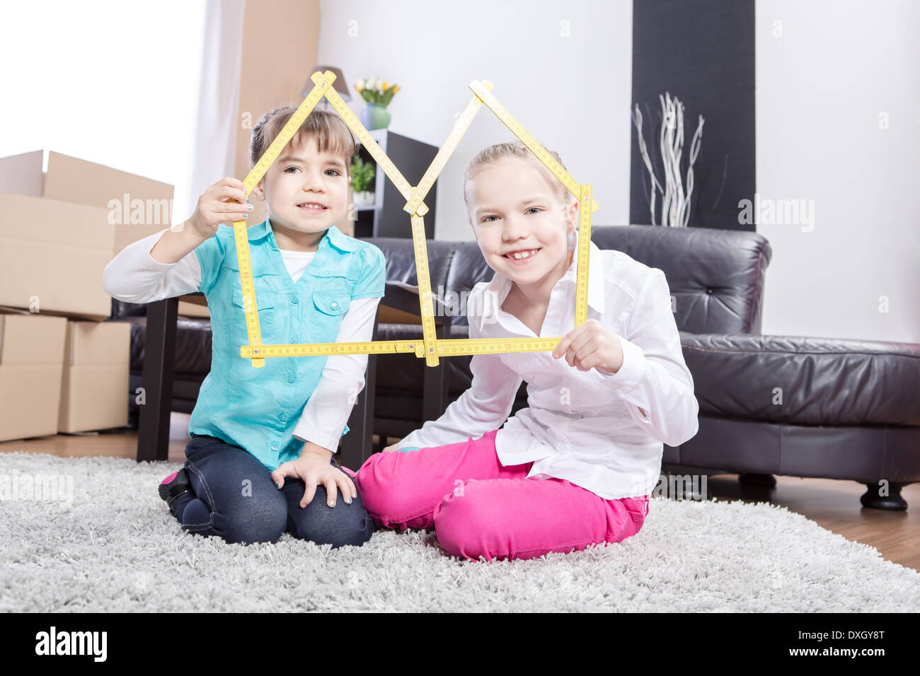 two young girls inside of their new home Stock Photo - Alamy