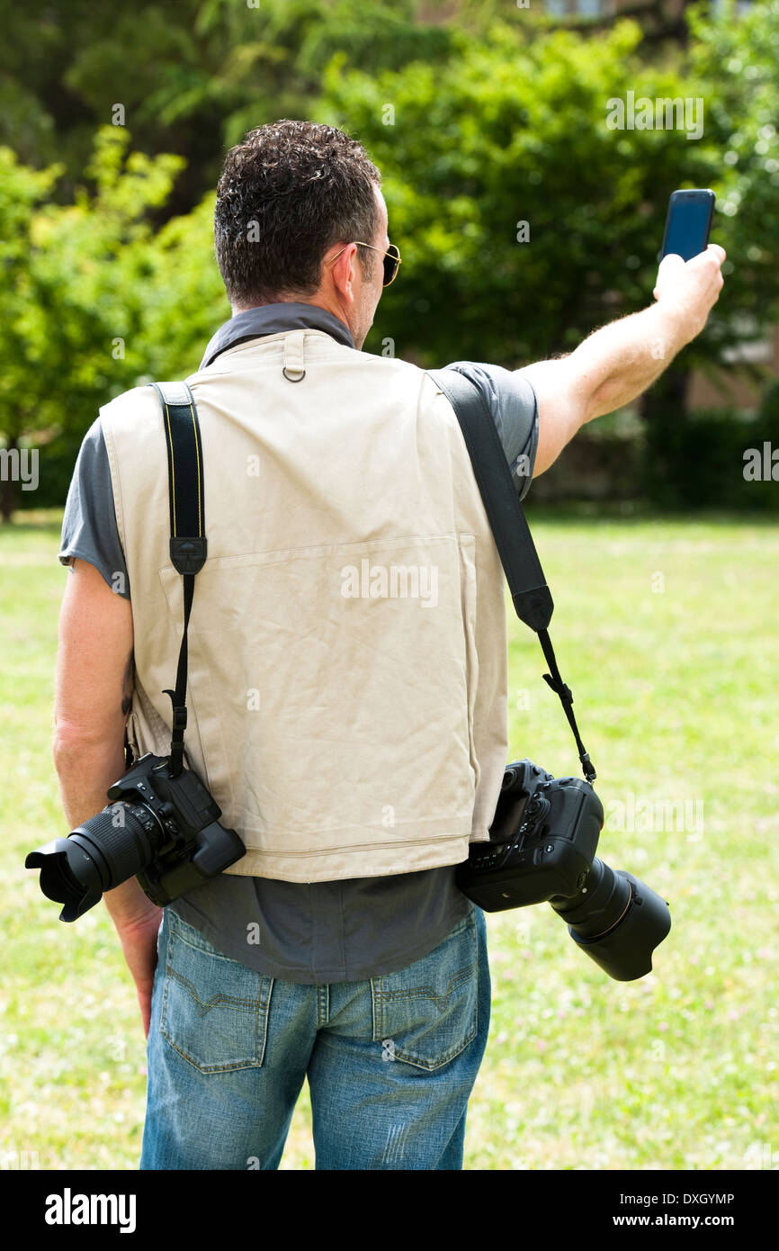 Photographer shooting outdoors Stock Photo - Alamy
