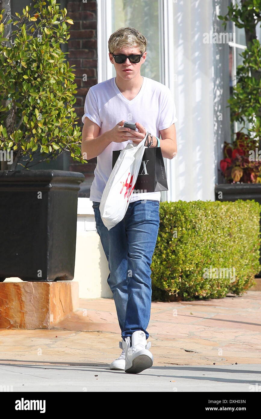 Niall Horan of One Direction seen out shopping at Armani Exchange and H ...