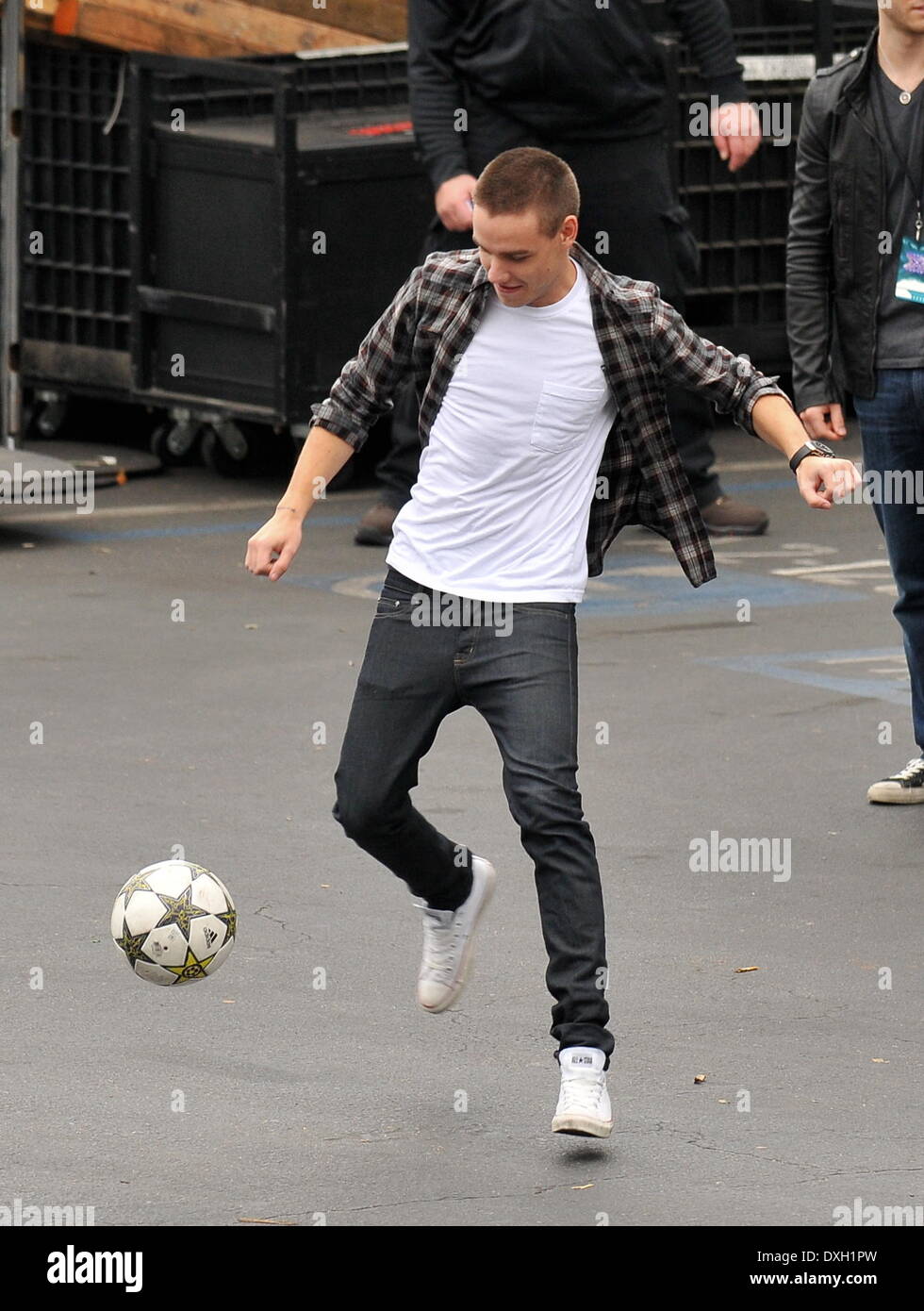Liam Payne One Direction band members playing soccer in the parking lot ...