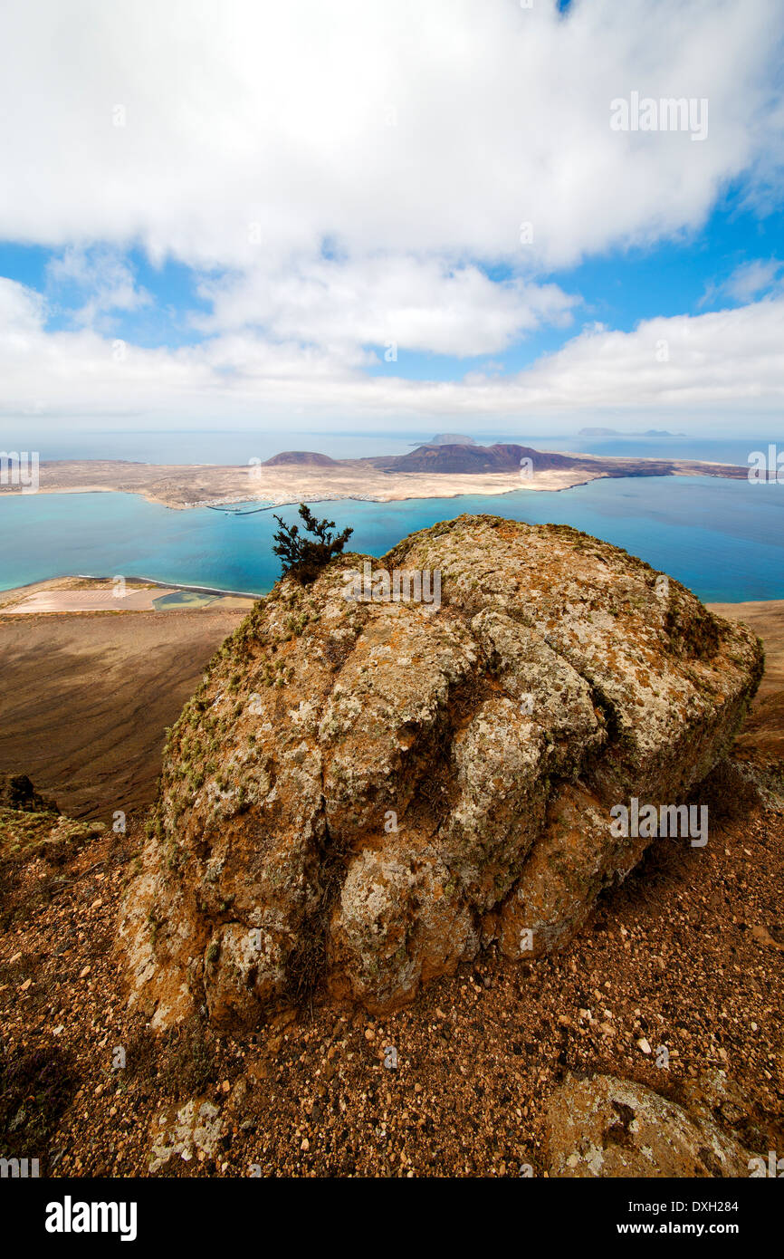 harbor rock stone sky cloud beach boat yacht water in lanzarote spain ...