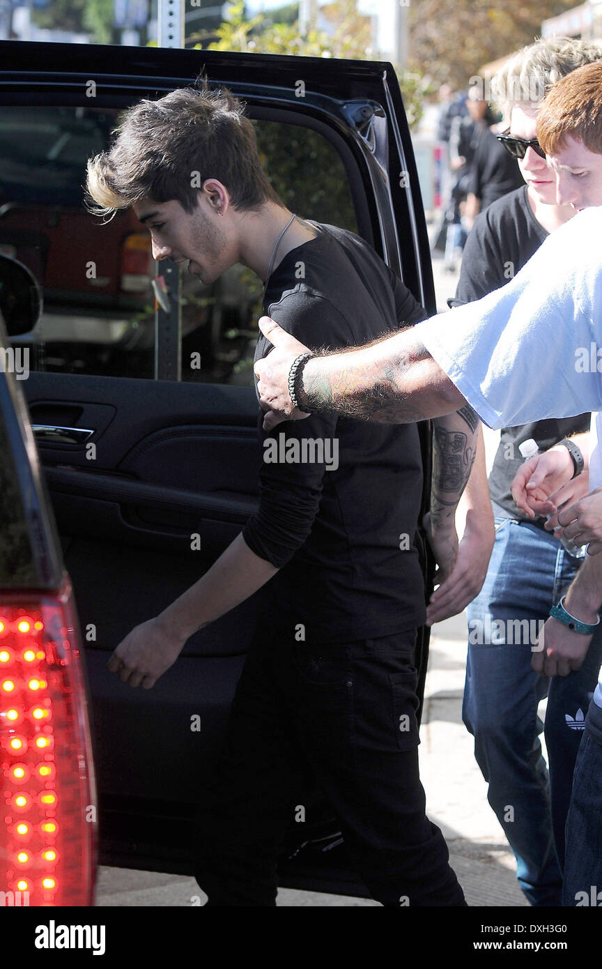 Zayn Malik Members of One Direction return to their vehicle after ...