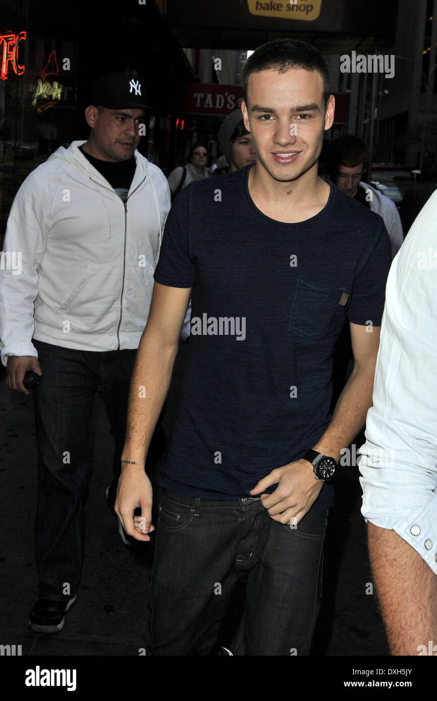 Liam Payne One Direction exits Toys 'R' Us in Times Square with nerf ...