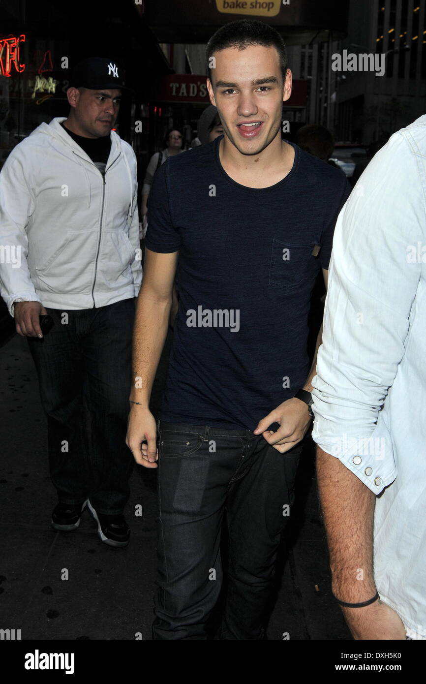 Liam Payne One Direction exits Toys 'R' Us in Times Square with nerf ...