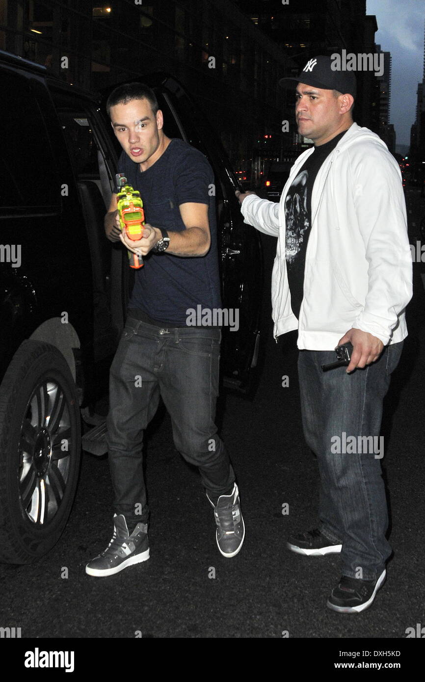 Liam Payne One Direction exits Toys 'R' Us in Times Square with nerf ...