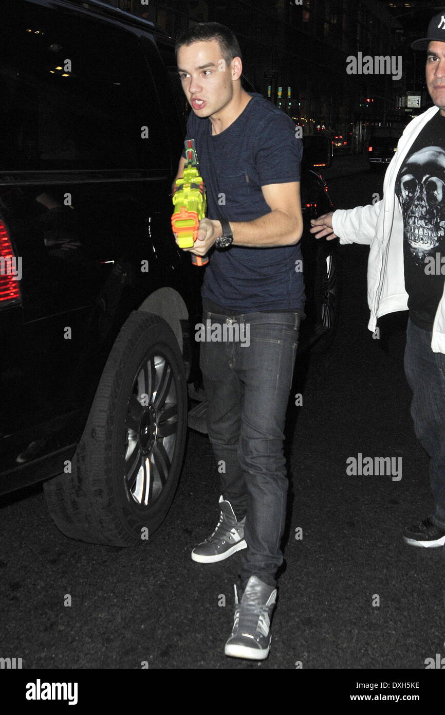 Liam Payne One Direction exits Toys 'R' Us in Times Square with nerf ...