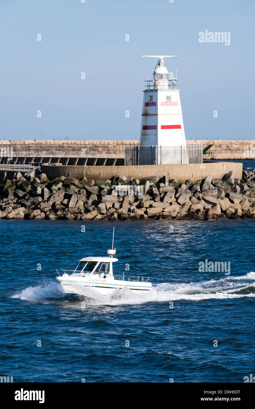Small white boat passes hi-res stock photography and images - Alamy