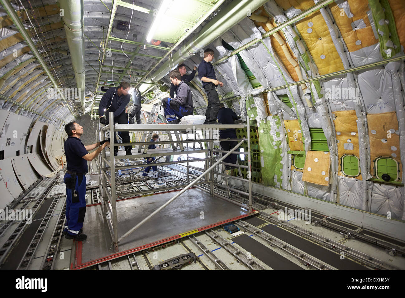 Employees of company Haitec Aircraft Maintenance work on the interior ...