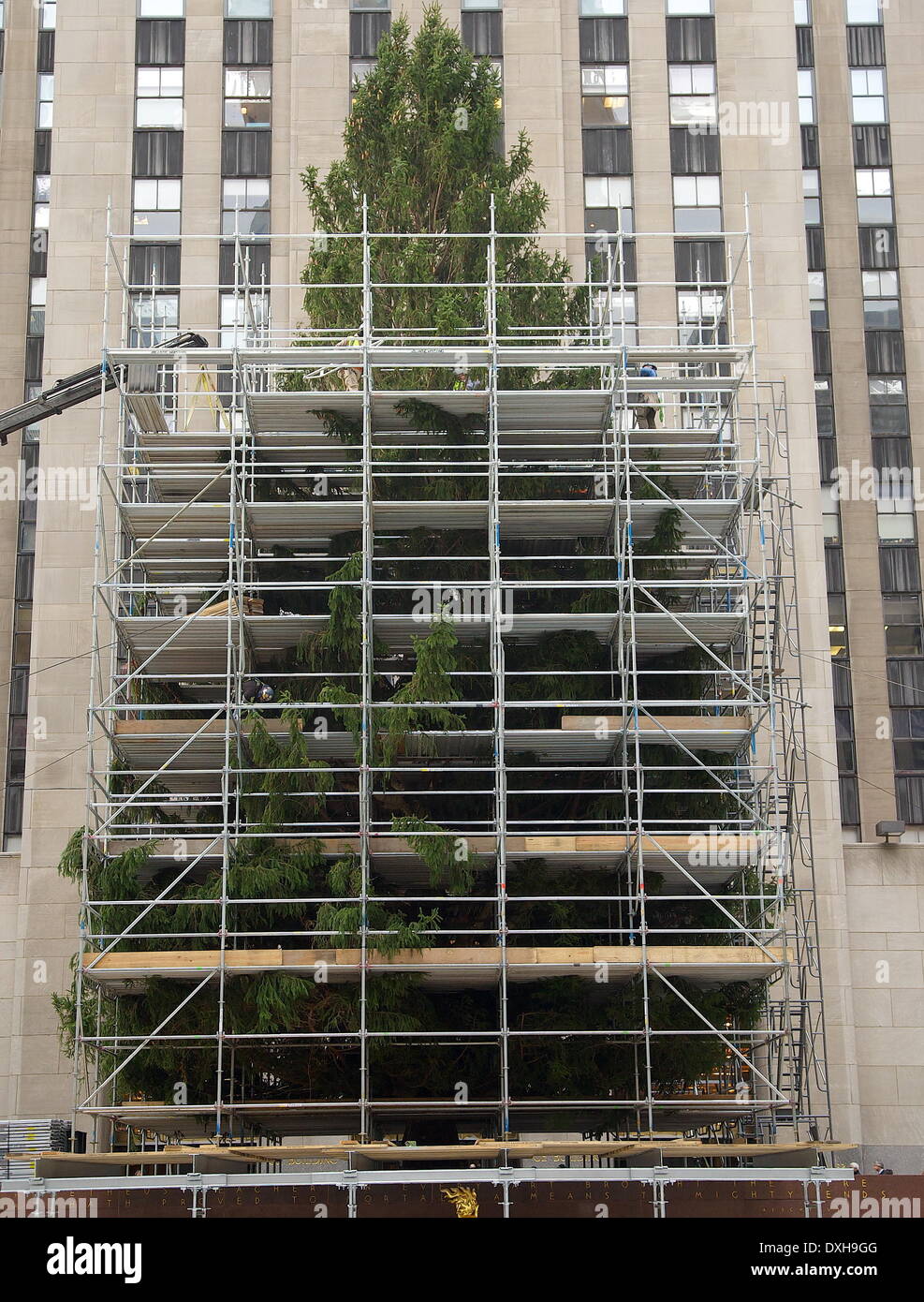 Construction workers build a scaffold around the 2012 Rockefeller ...