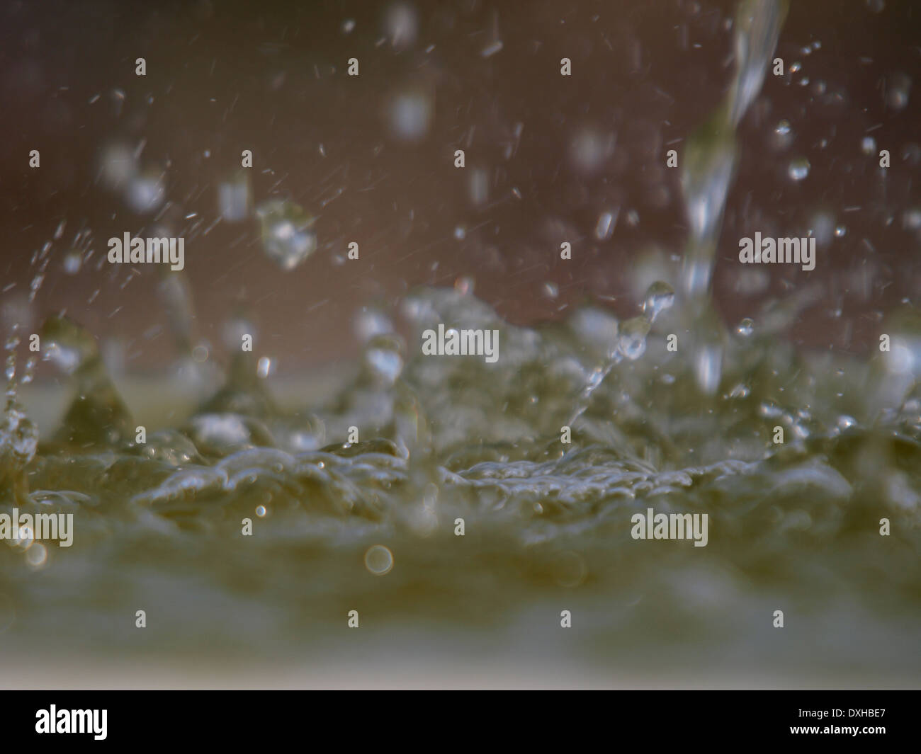 Raindrops on puddle hi-res stock photography and images - Alamy