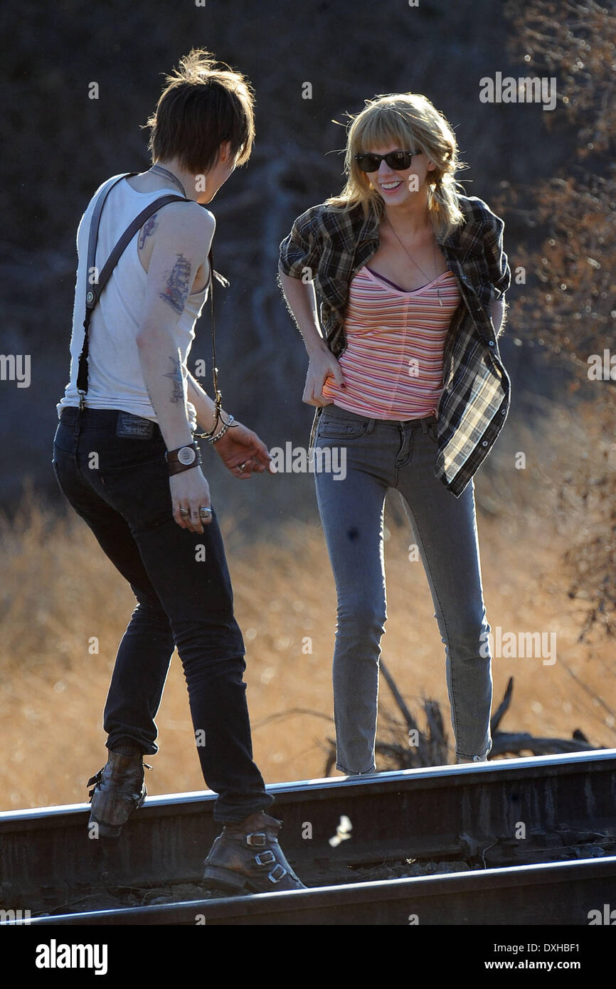 Singer Taylor Swift gets a piggy back ride by co star Reeve Carney on ...