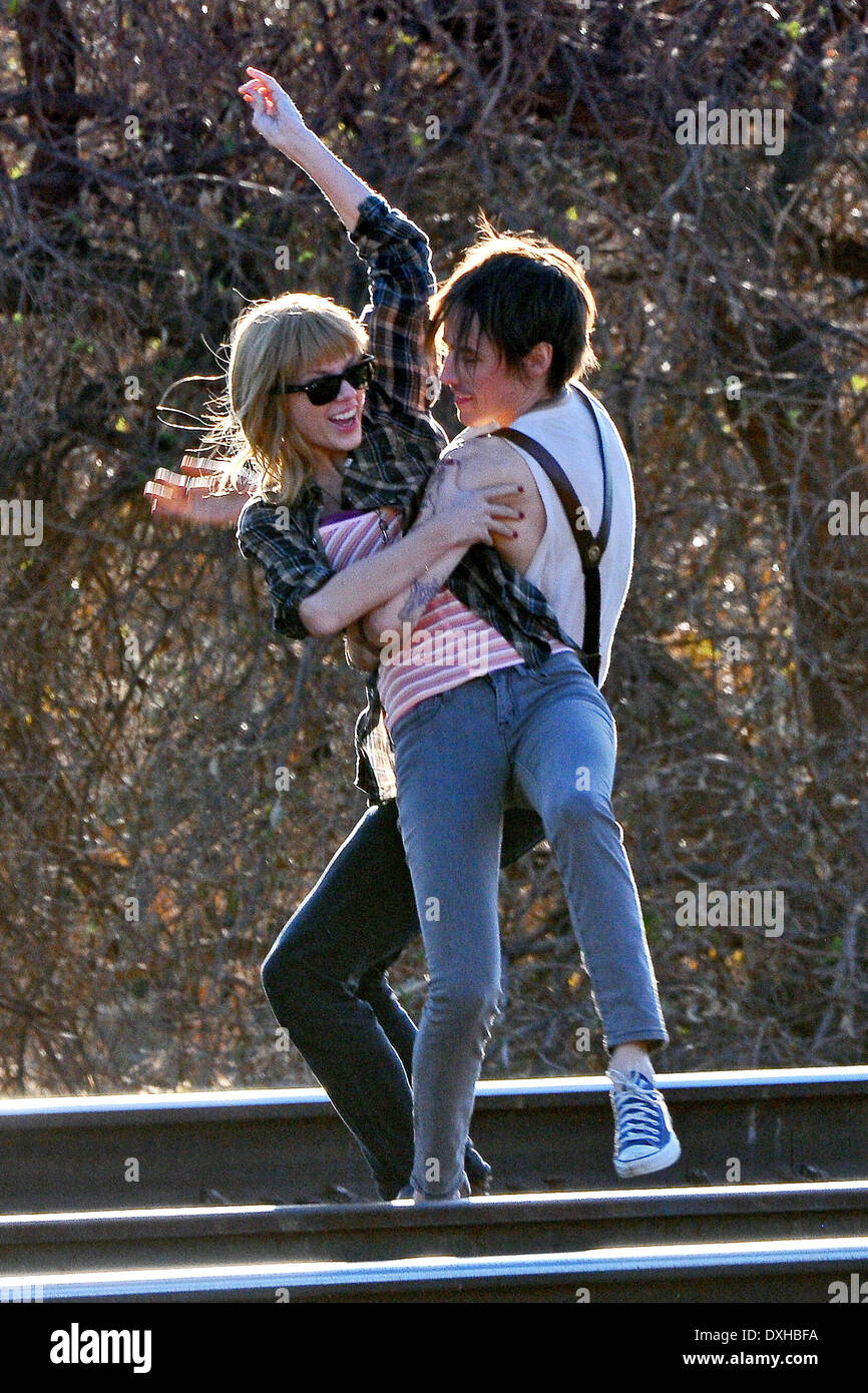 Singer Taylor Swift gets a piggy back ride by co star Reeve Carney on ...