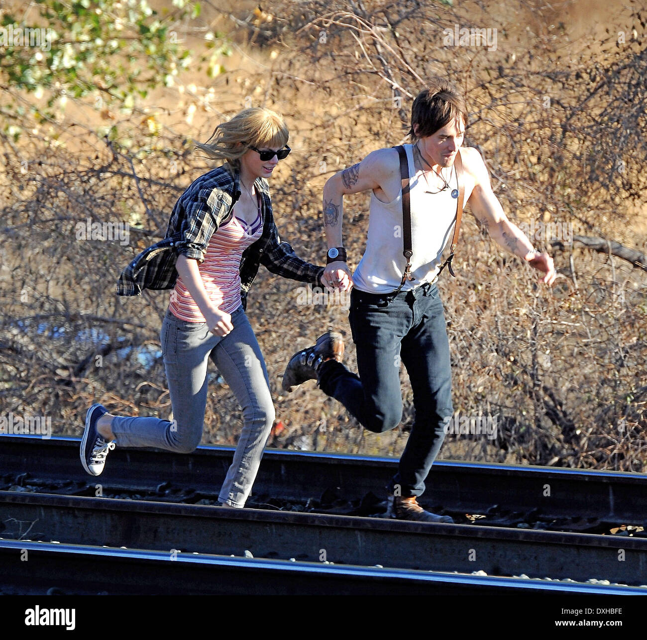 Singer Taylor Swift gets a piggy back ride by co star Reeve Carney on ...