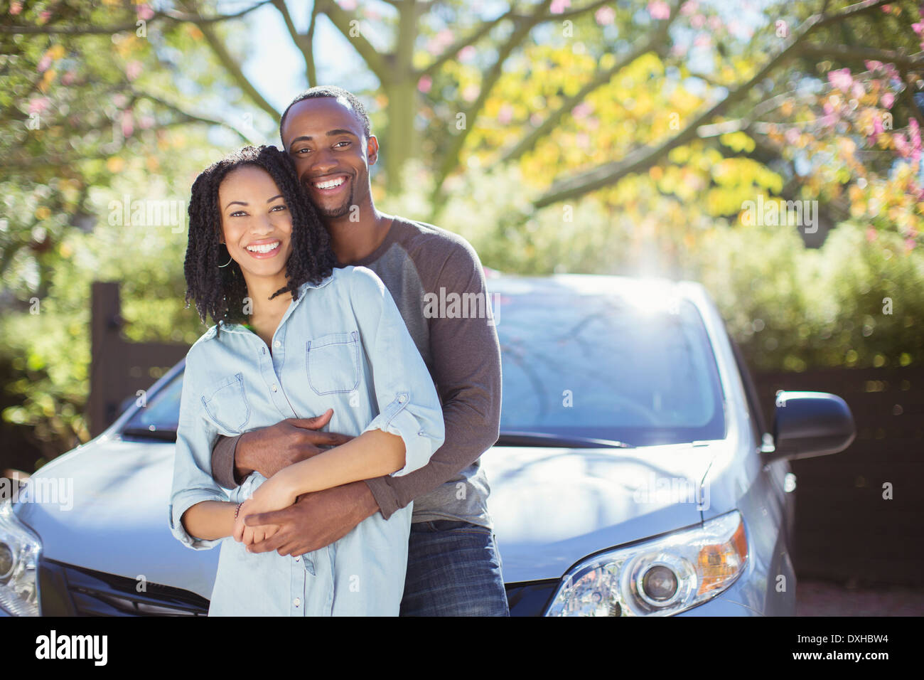 Portrait happy couple hugging hi-res stock photography and images - Alamy