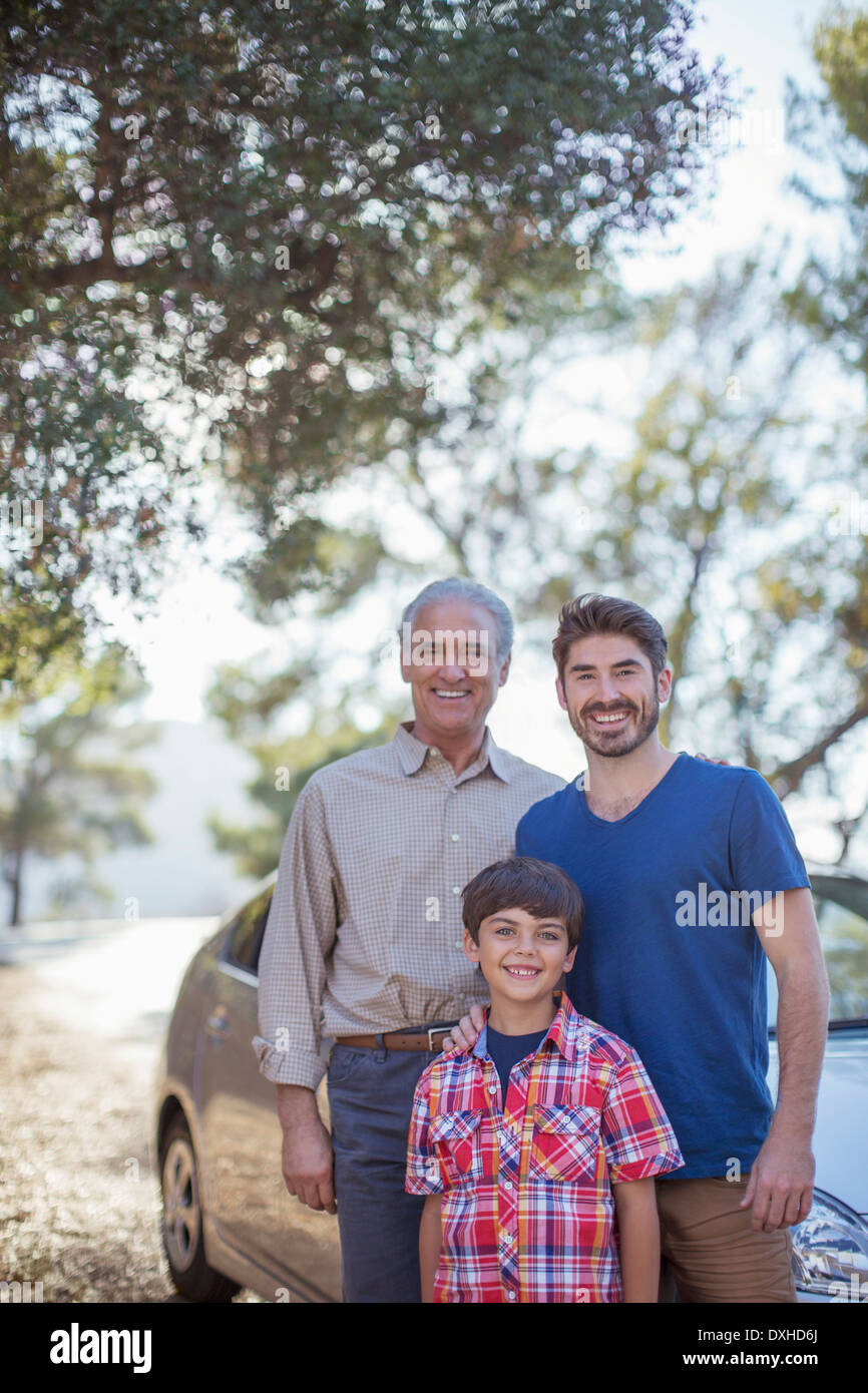 Portrait of multi-generation men outside car Stock Photo - Alamy