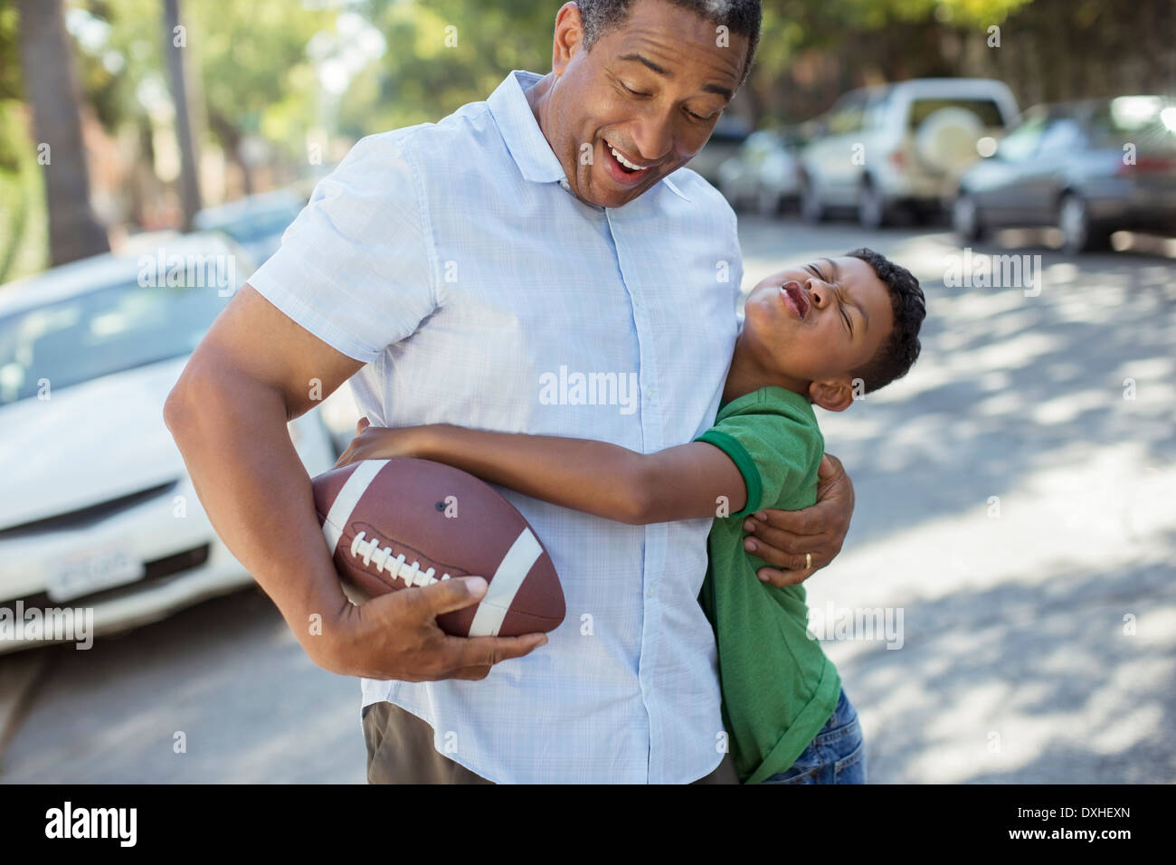 Football on head street hi-res stock photography and images - Alamy