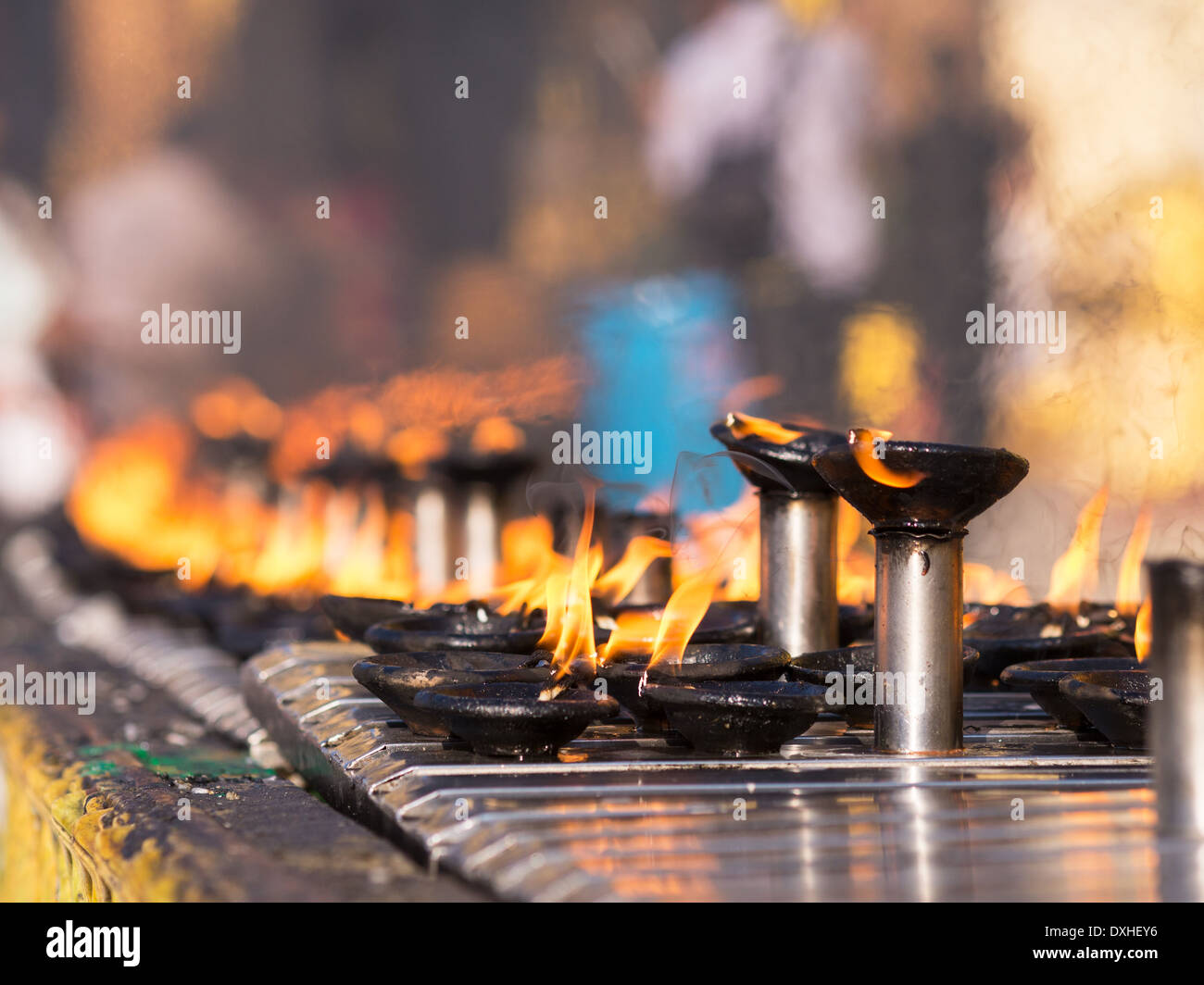 Burning oil lamps at the Shwedagon Pagoda in Yangon, the capital of ...