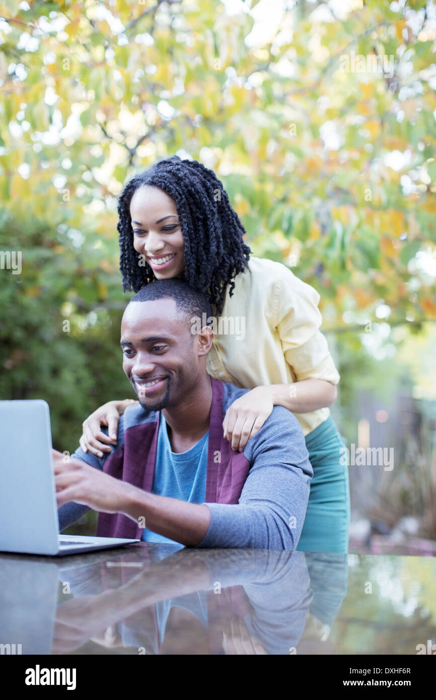 Young couple using laptop personal hi-res stock photography and images ...
