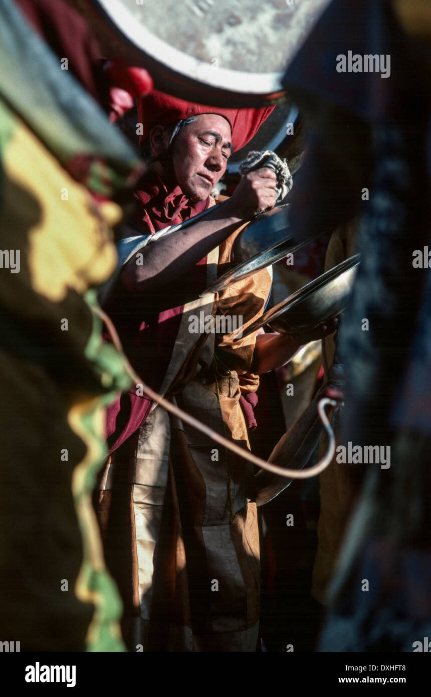 Monks playing the traditional Tibetan Buddhist brass cymbals at stok ...