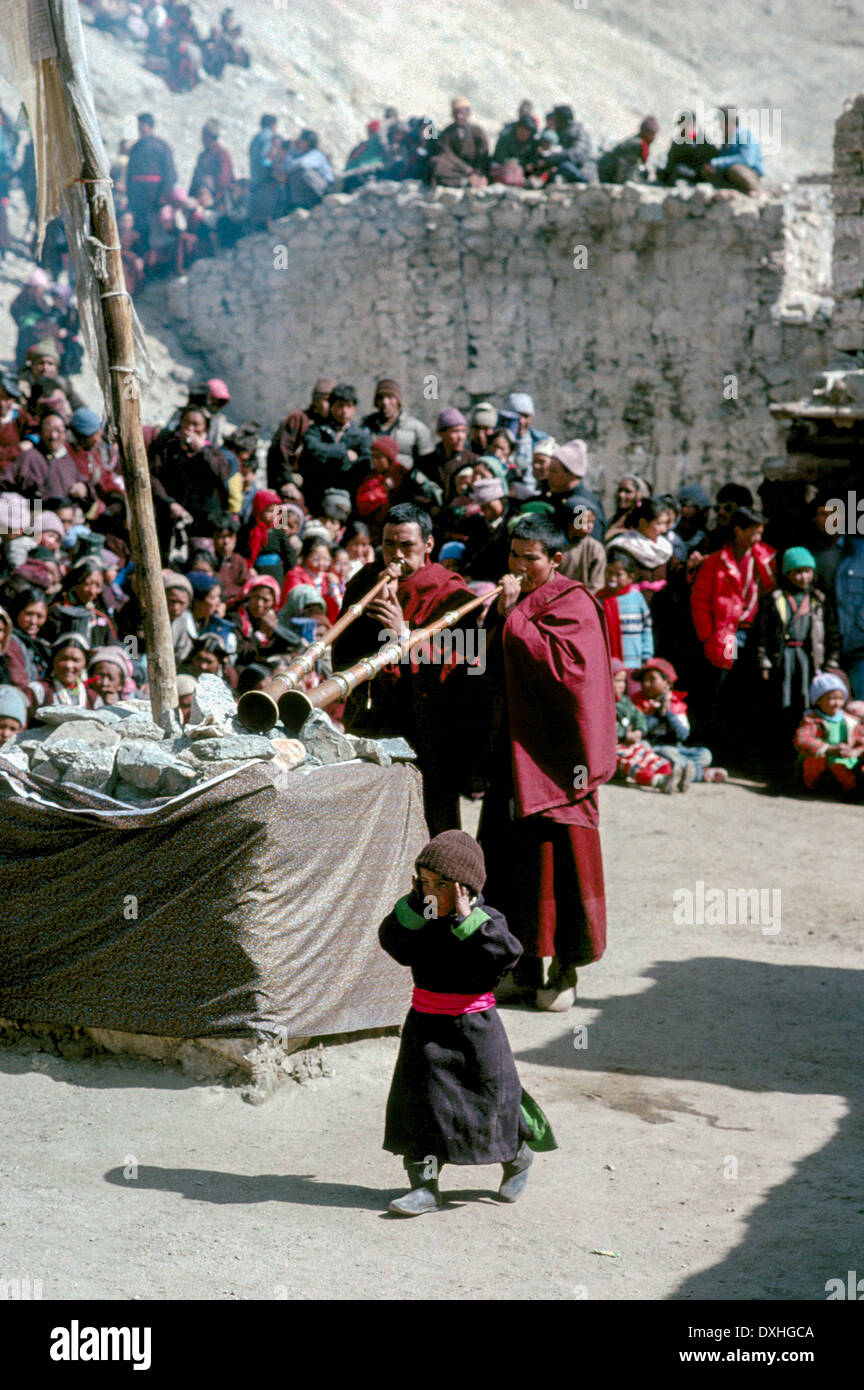 Ladakh Leh monastery monks playing traditional long horns leaning on ...