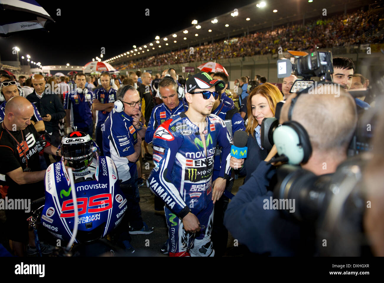 Losail International Circuit, Qatar. MotoGP riders wait on start grid ...