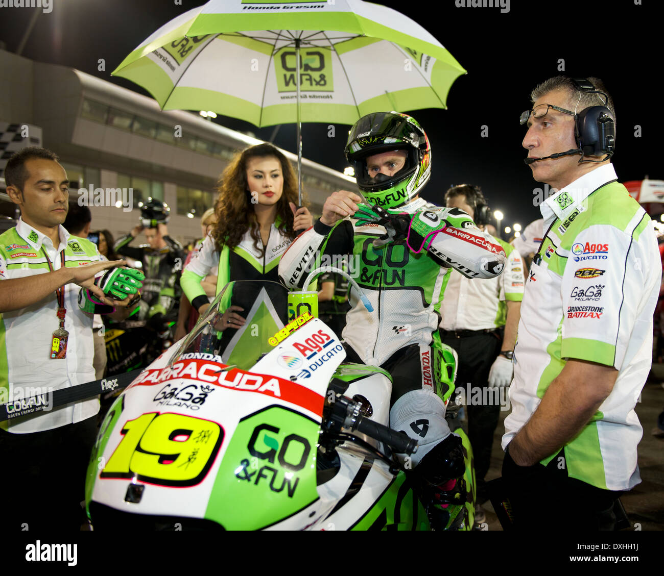 Losail International Circuit, Qatar. MotoGP riders wait on start grid ...