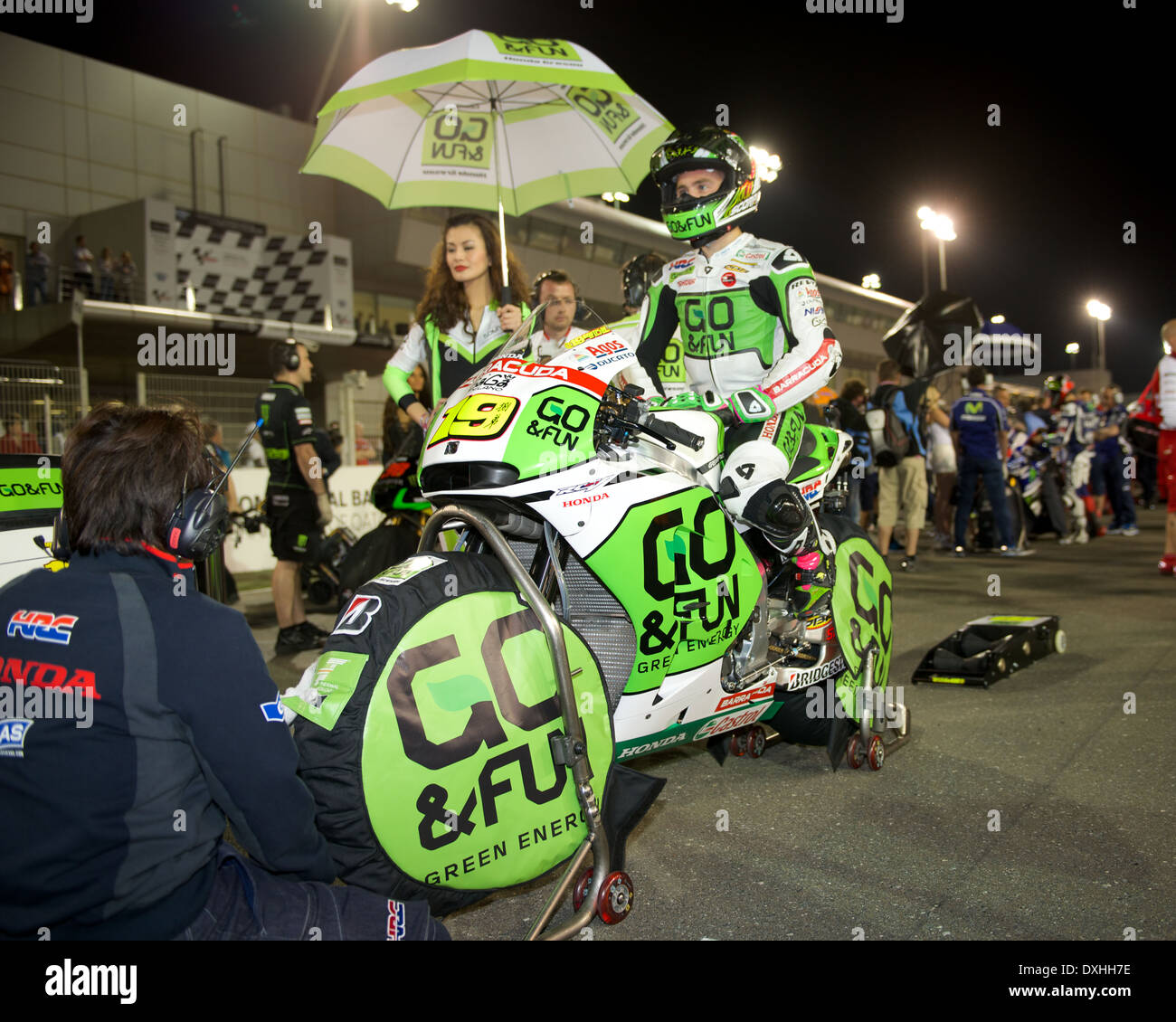 Losail International Circuit, Qatar. MotoGP riders wait on start grid ...