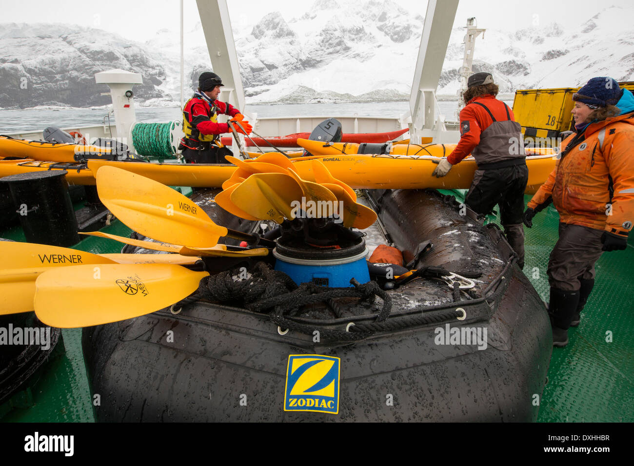 Zodiaks and sea kayaks on the deck of an expedition cruise ship, off ...