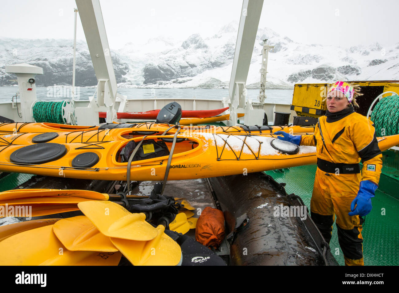 Zodiaks and sea kayaks on the deck of an expedition cruise ship, off ...