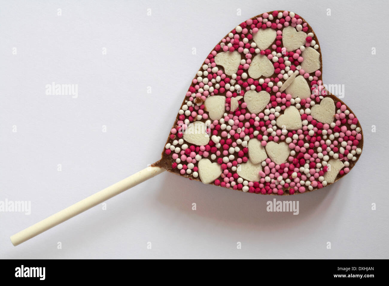 heart shaped chocolate lolly lollipop isolated on white background ...