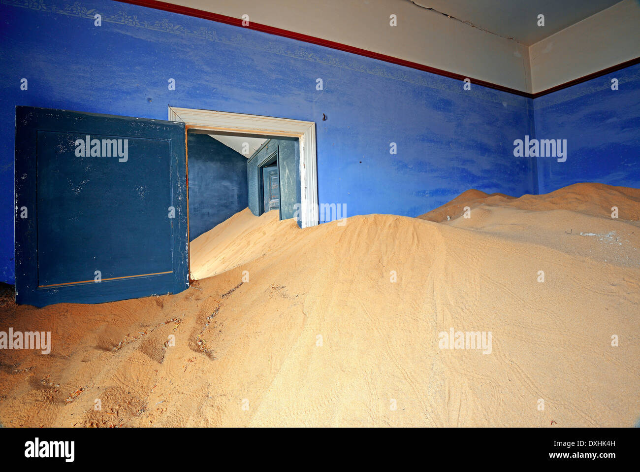 Building taken over by sand from the desert former diamond mining town ...