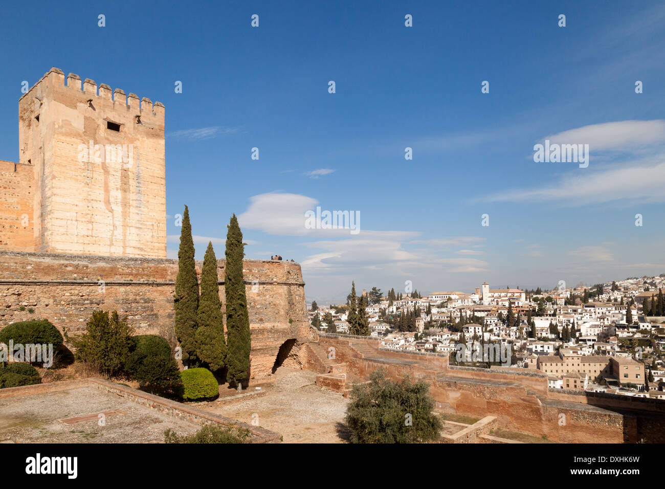 A tower of the Alhambra Palace and a view over the city of Granada ...