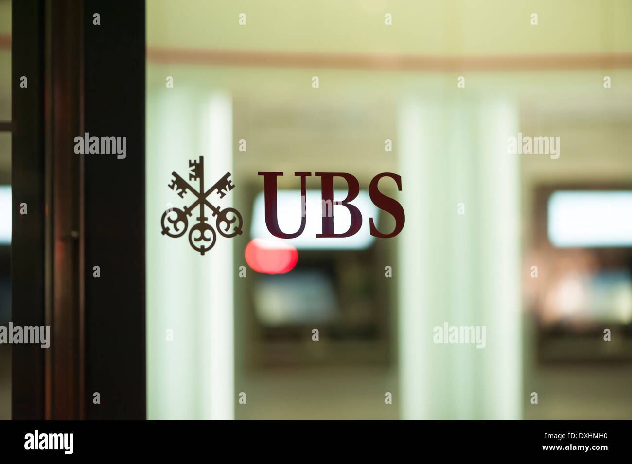 Logo of UBS, Switzerland's largest bank on the glass door of a UBS ...