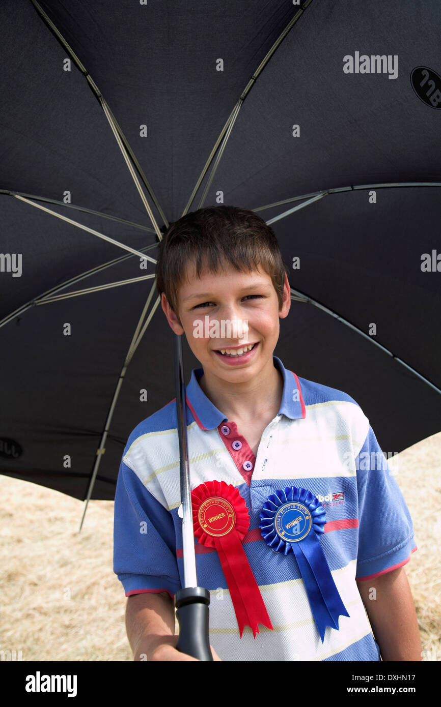 Model Released image of Red and blue winner badges on a boy´s chest as ...