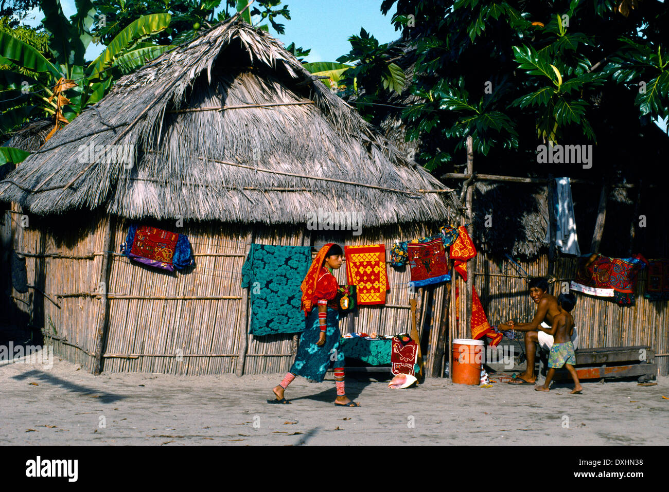 San Blas Island Panama Guna Indian Woman And Thatched House Stock Photo ...