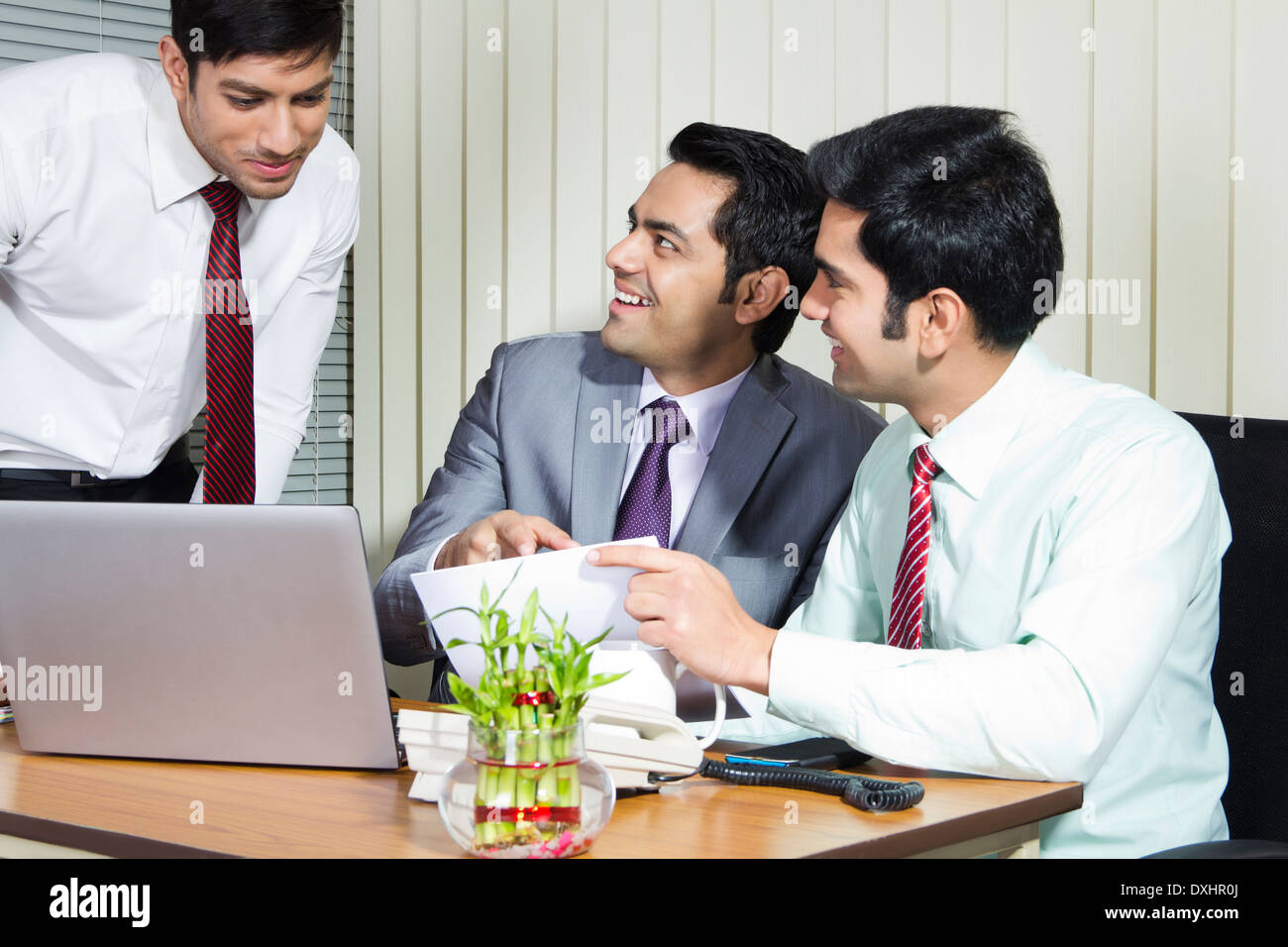Indian Businessman sitting in Office and Disscussing Stock Photo - Alamy