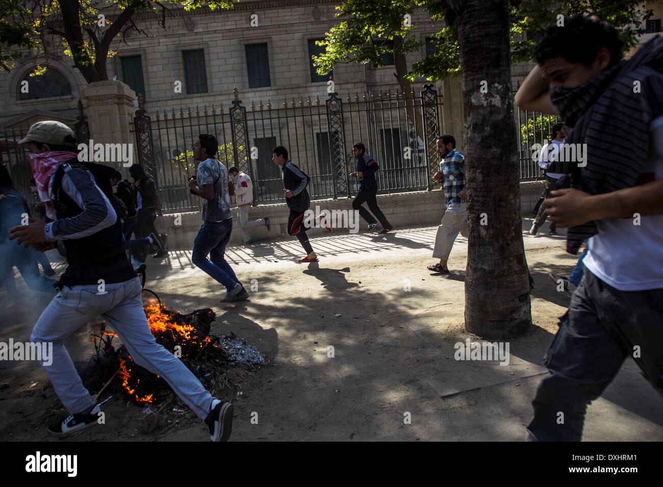 Cairo, Egypt. 26th Mar, 2014. Anti-military university students run ...