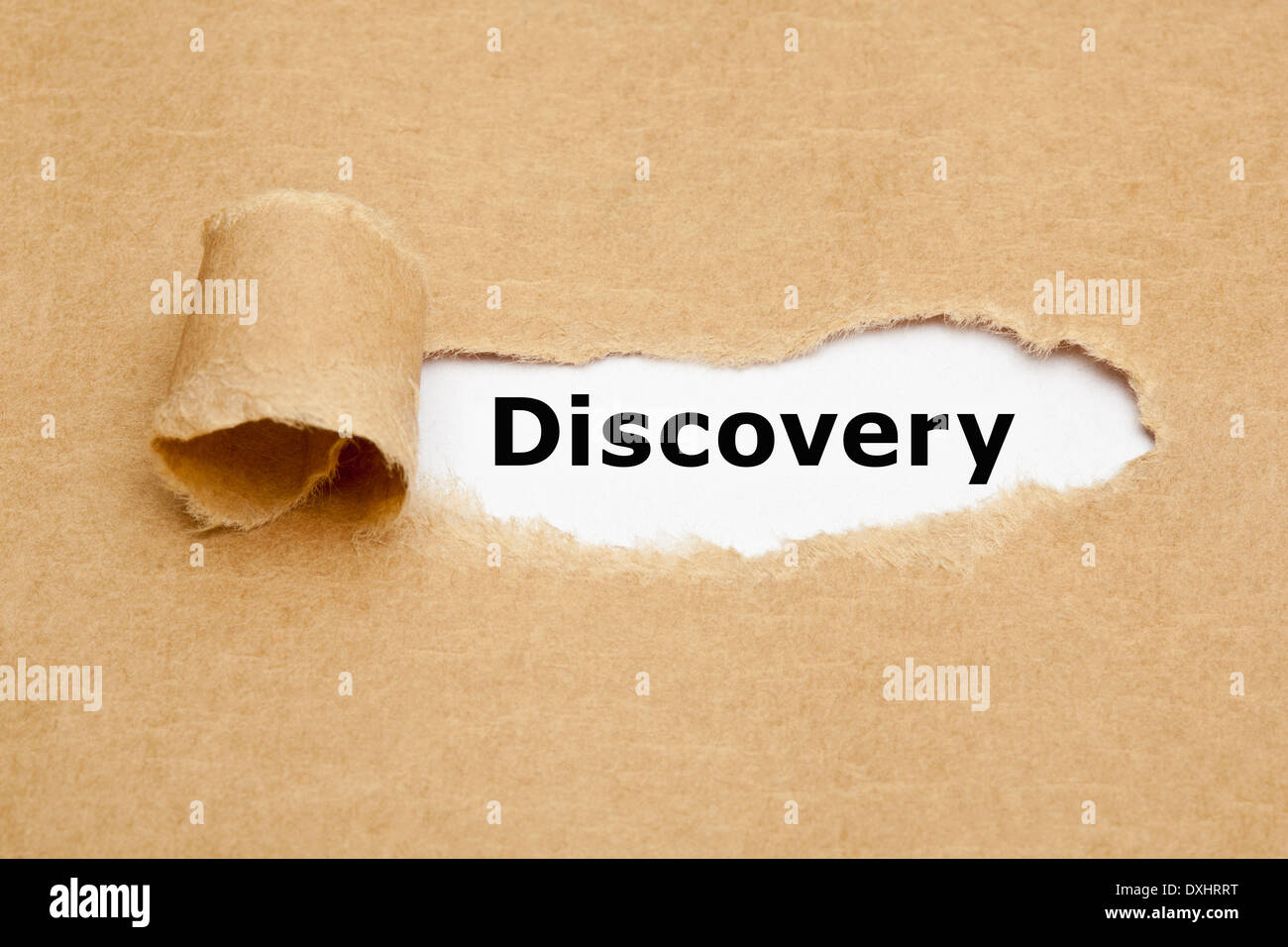 The word Discovery appearing behind torn brown paper Stock Photo - Alamy