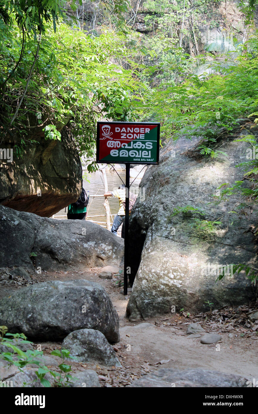 Danger board placed near a Meenmutty waterfall in India Stock Photo - Alamy