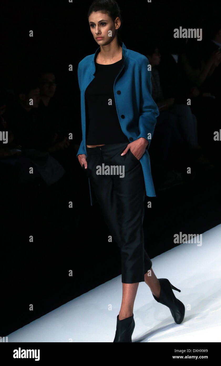 Beijing, China. 26th Mar, 2014. A model presents a creation designed by ...