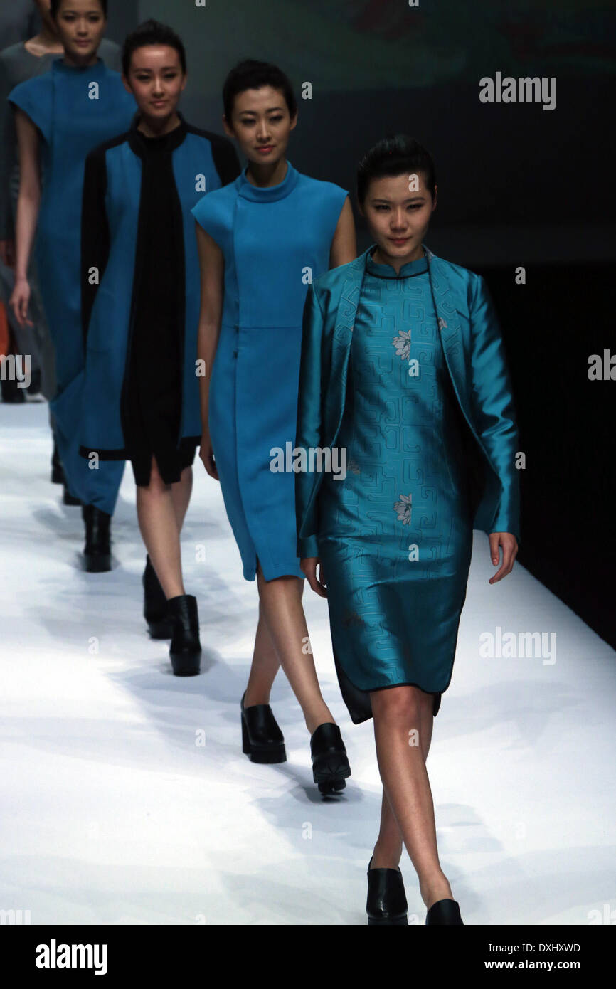 Beijing, China. 26th Mar, 2014. Models present creations designed by ...
