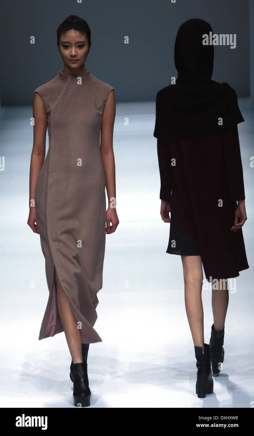 Beijing, China. 26th Mar, 2014. A model presents a creation designed by ...
