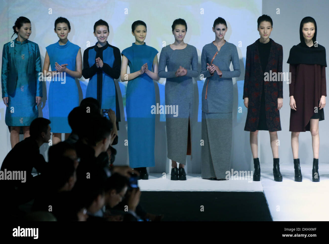 Beijing, China. 26th Mar, 2014. Models present creations designed by ...