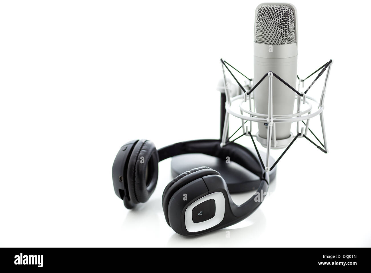 Studio microphone for recording podcasts with headset on a white ...