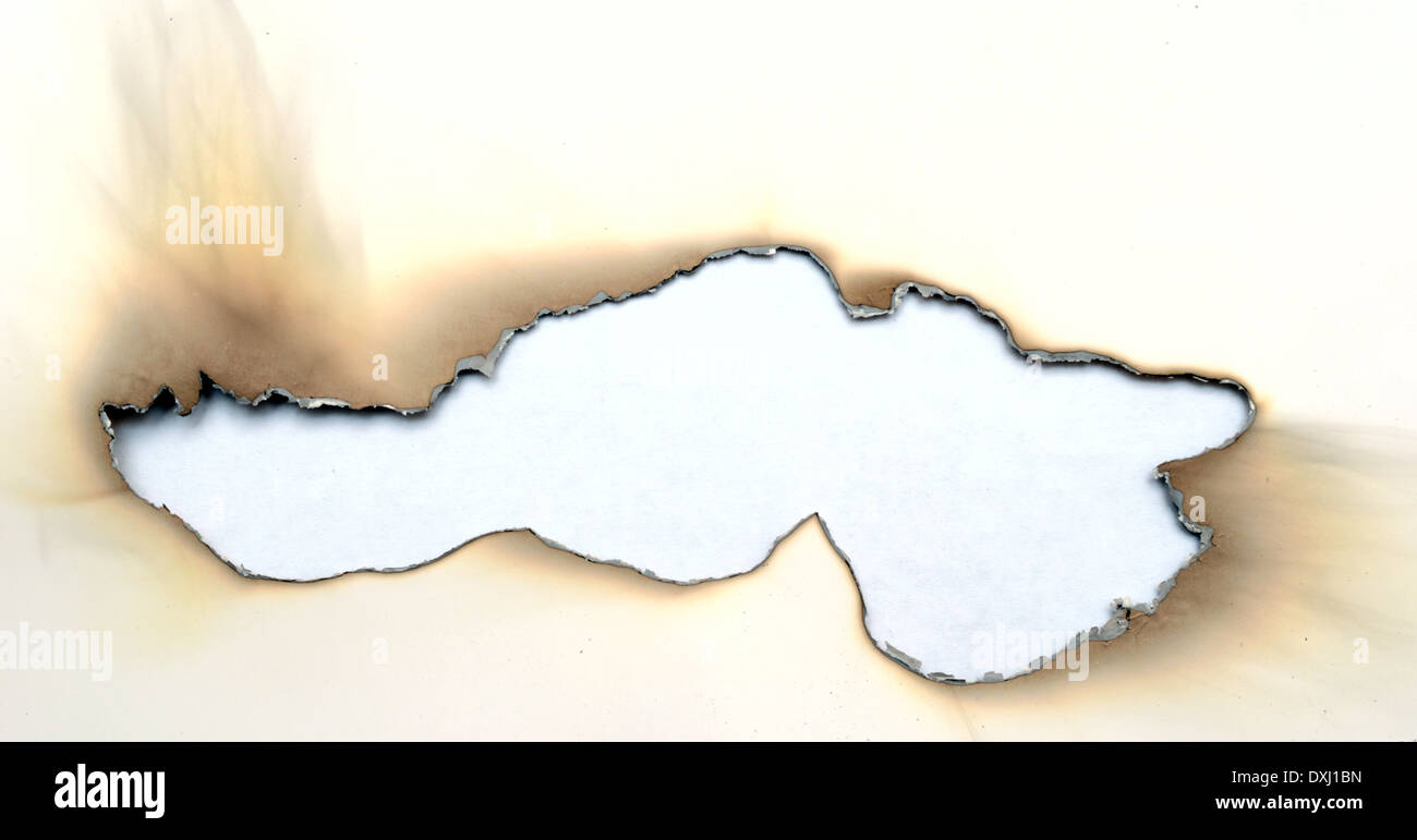 burnt hole in a paper Stock Photo - Alamy