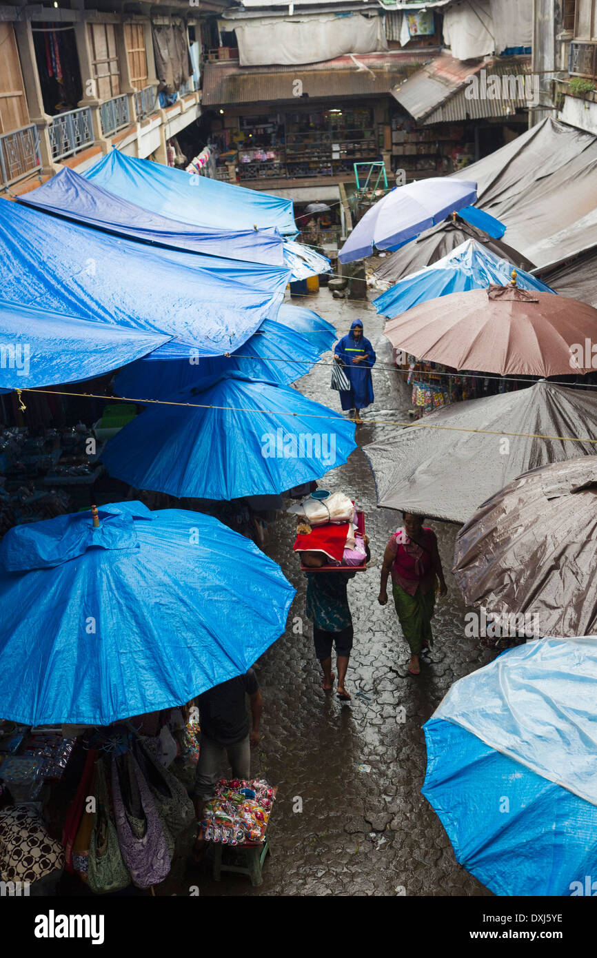 Rain falling over tarps and awnings of market stalls, Ubud, Bali ...