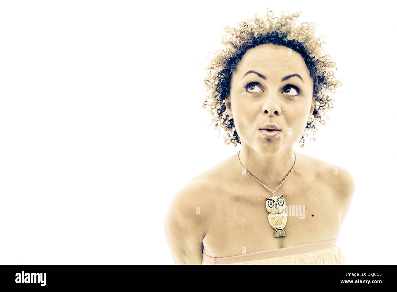 Portrait of curious woman wearing owl necklace Stock Photo - Alamy